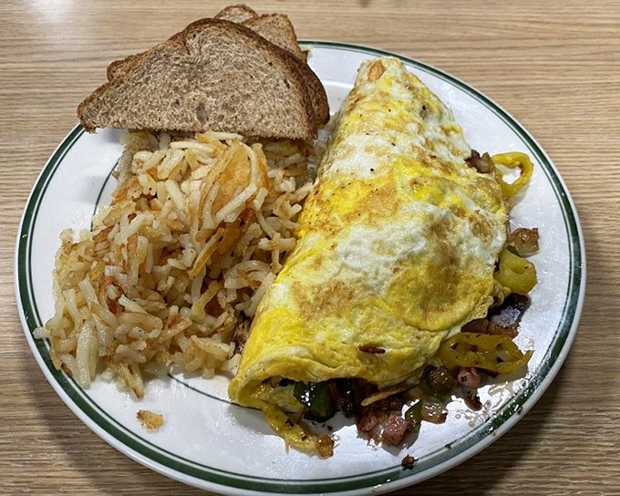 When you can't decide what to put in your omelet, the answer is clearly "everything." This golden envelope of breakfast goodness delivers.