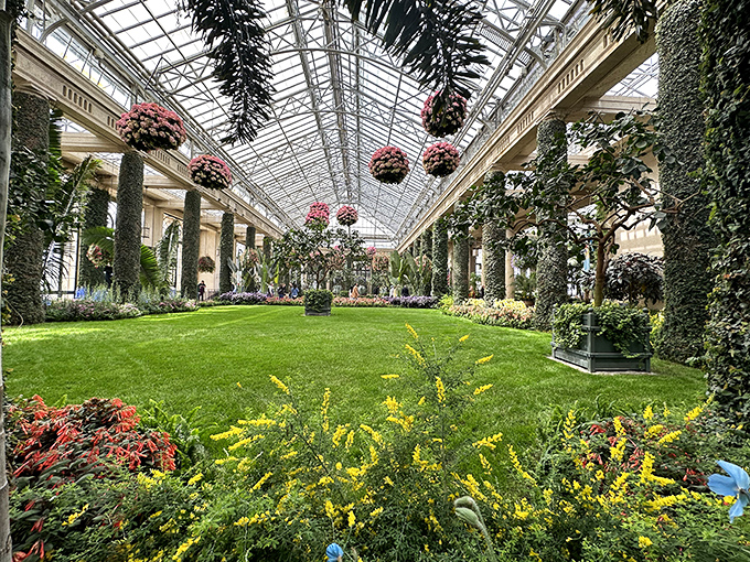 Inside the Conservatory, hanging baskets create a ceiling of color that makes your local garden center look like a parking lot.