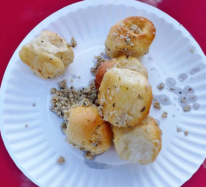 These garlic rolls aren't just side dishes &ndash; they're little pillowy miracles that could start religions. Garlicky, buttery, and absolutely worth the breath mints.