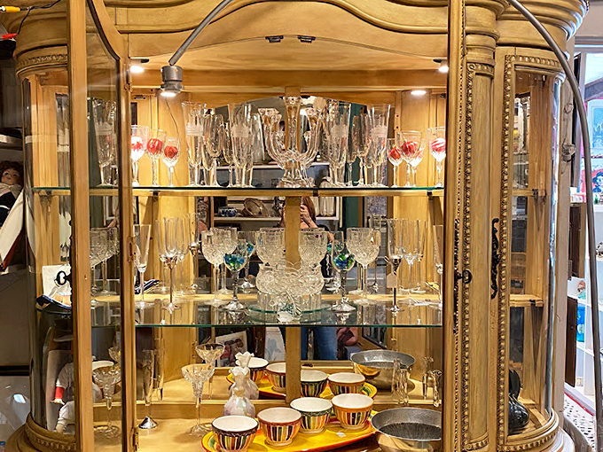 Crystal stemware stands at attention in this elegant display case, ready to elevate your next toast to something special.