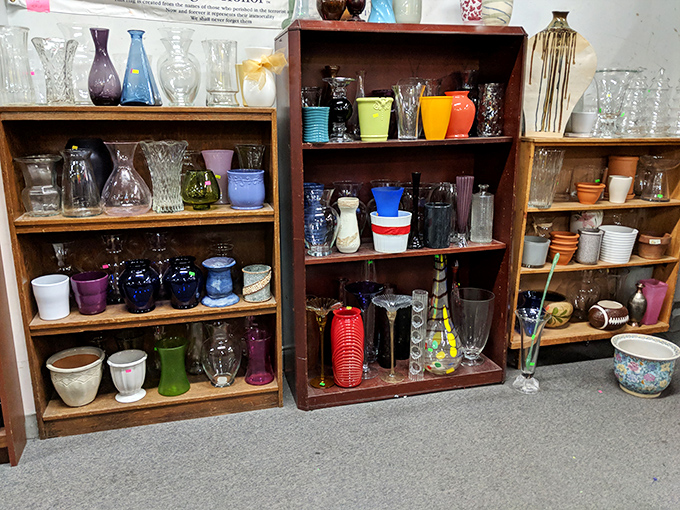 Crystal, colored glass, and vintage vessels line these wooden shelves &ndash; each with stories to tell from dinner parties of decades past.