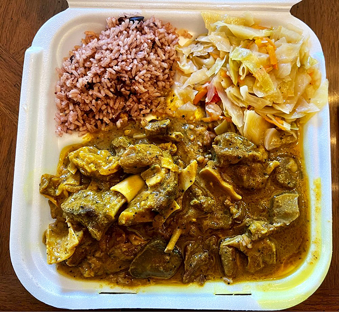 Curry goat that would make your Jamaican grandmother nod in approval, with that distinctive yellow sauce carrying turmeric's earthy magic.
