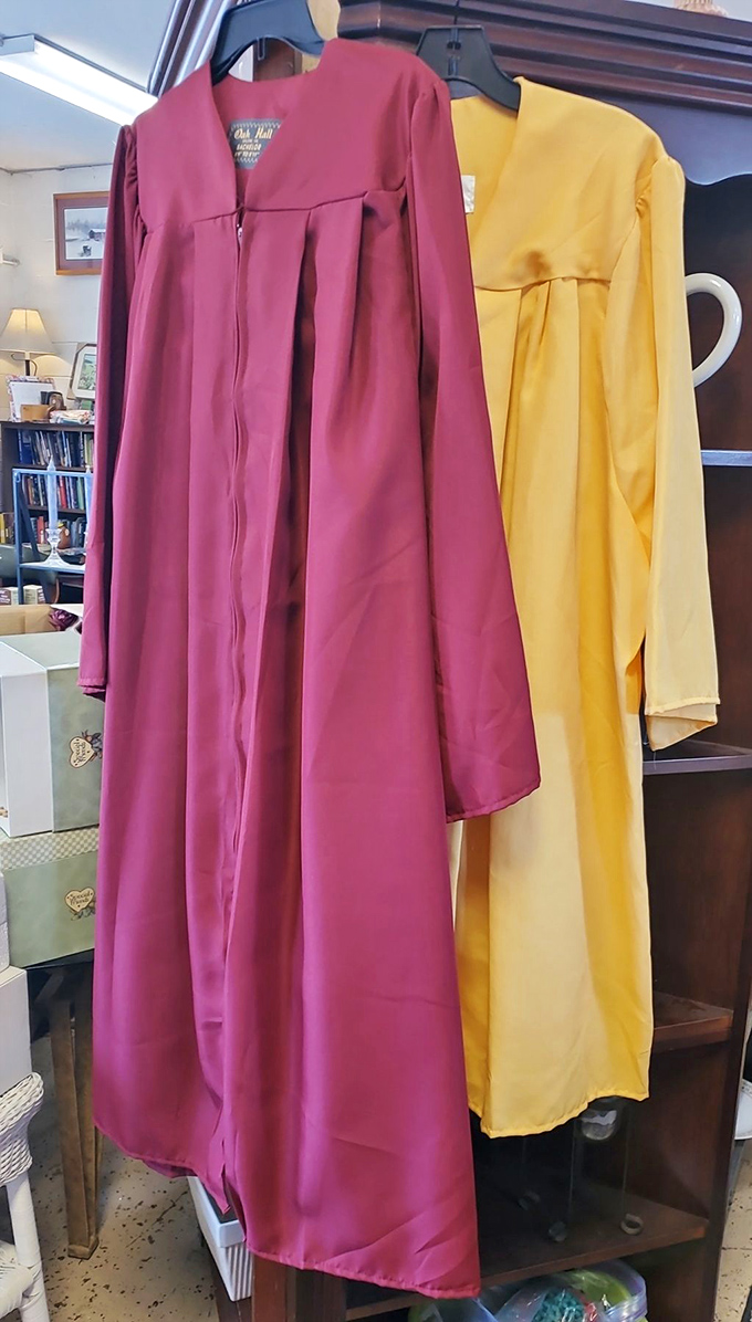 These graduation gowns hang patiently, ready for their second commencement—proof that wisdom can be recycled too.