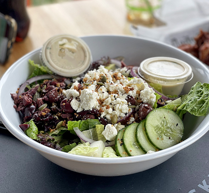 A salad that doesn't apologize for being healthy—it's too busy showing off with fresh ingredients and house-made dressing.