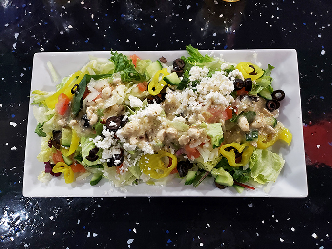 Fresh ingredients playing together in perfect harmony. This Greek salad offers a lighter option that doesn't sacrifice an ounce of flavor&mdash;a Mediterranean vacation on a plate.