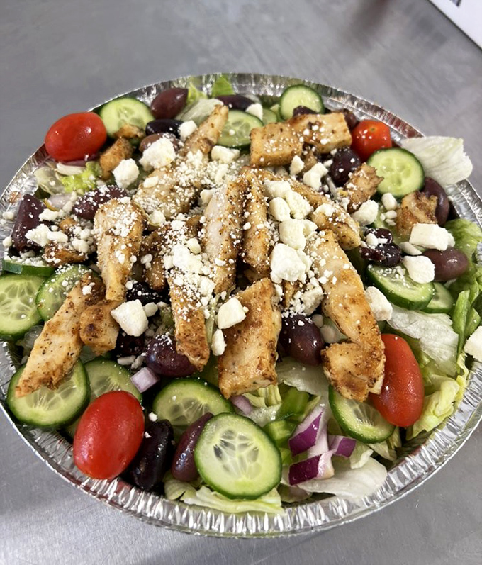 This Greek salad isn't just the token healthy option—it's a Mediterranean vacation on a plate, with feta crumbles generous enough to make Zeus proud.