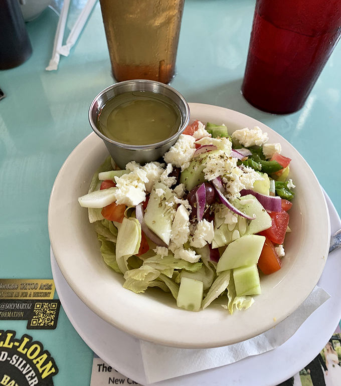 A Greek salad that actually looks like vegetables, not an afterthought. That feta isn't shy &ndash; it's the star of the show.