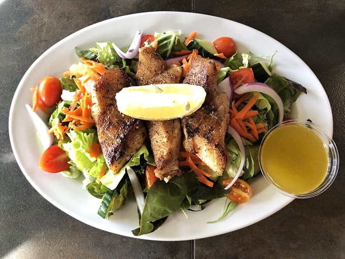 Grilled cod perched atop a garden of greens proves that "healthy choice" and "absolutely delicious" aren't mutually exclusive concepts after all.