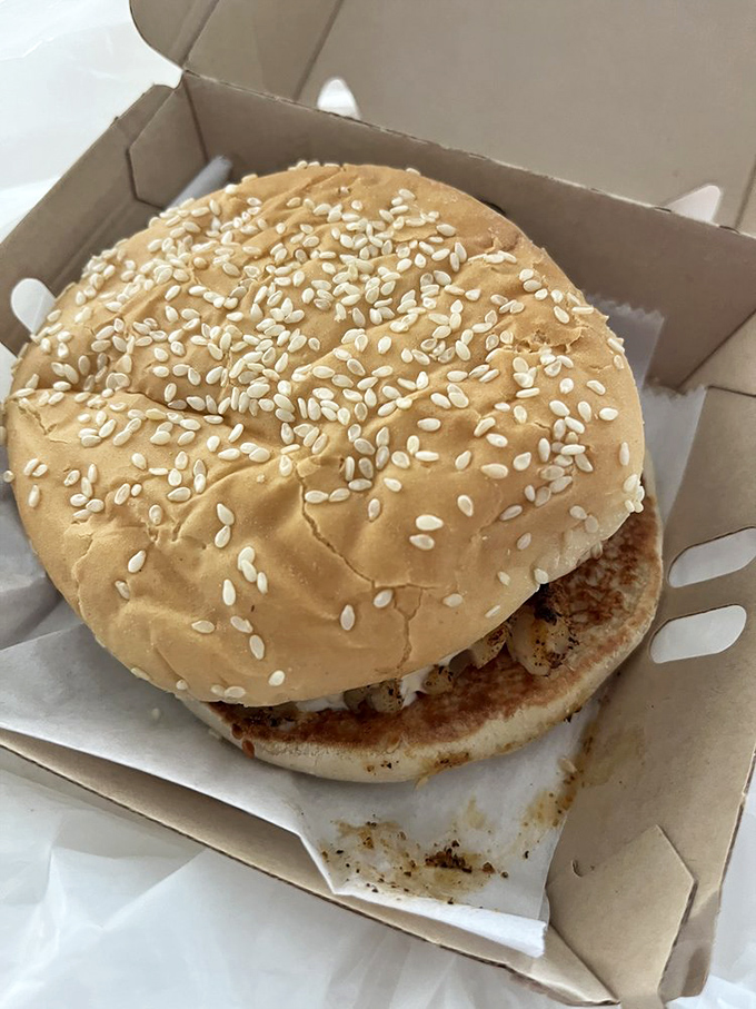 The sesame-studded bun serves as the perfect vessel for whatever Gulf treasure you've chosen for your sandwich adventure.