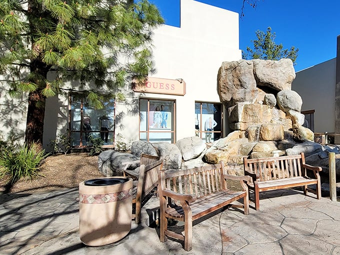 GUESS storefront offers a moment of serenity with its rock garden and wooden benches. Shop, sit, contemplate your next purchase – retail therapy at its finest.