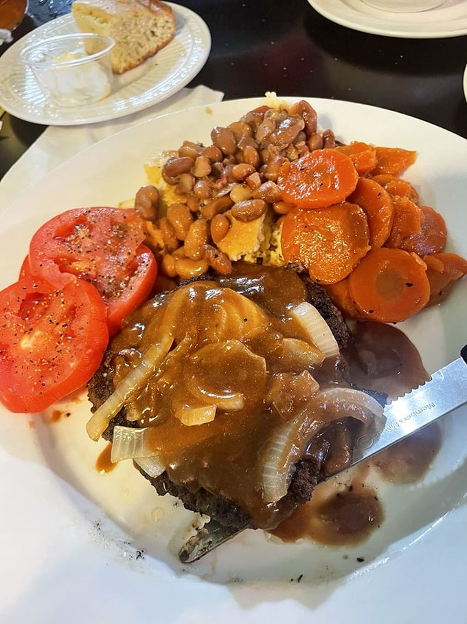 This hamburger steak isn't just covered in gravy &ndash; it's swimming in a savory pool with beans and vegetables cheering from the sidelines.