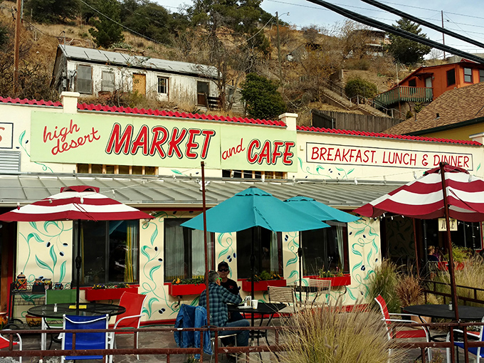 High Desert Market and Cafe offers shaded respite and locally-sourced delights. Those red umbrellas aren't just for show&mdash;they're beacons for hungry explorers navigating Bisbee's vertical landscape. 
