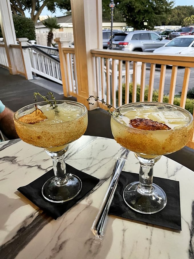 Cocktails on the porch &ndash; where Florida's sunshine gets transformed into liquid gold, garnished with herbs that look like they were picked minutes ago.