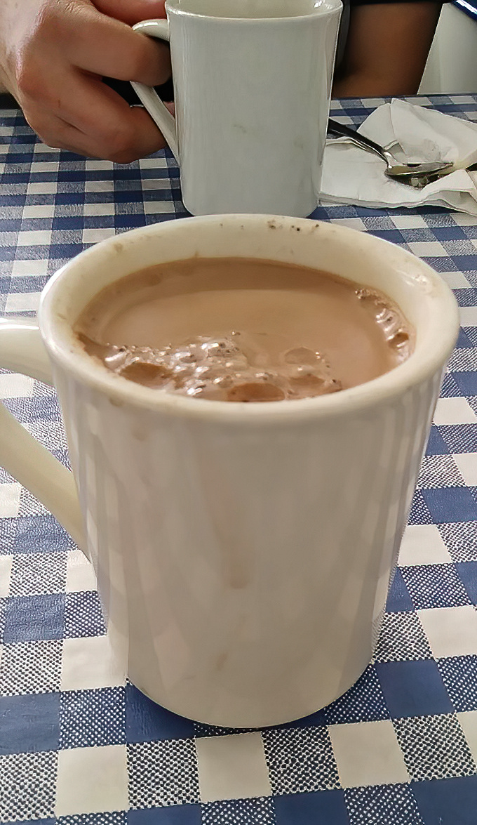 Coffee at Nick's comes in sturdy white mugs &ndash; the kind that say "I'm not here to be photographed, I'm here to wake you up."