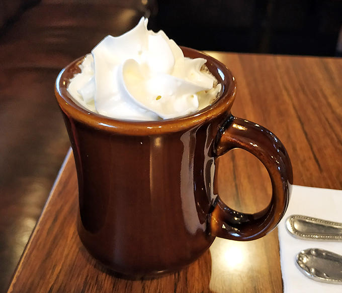 Hot chocolate topped with whipped cream mountains that would make the Swiss Alps jealous.