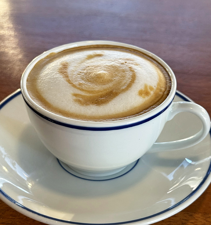 This latte's perfect spiral of foam isn't just Instagram bait&mdash;it's the morning meditation you didn't know you needed. Coffee artistry at its most drinkable.