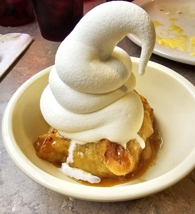 That's not just whipped cream&mdash;that's a cloud-like masterpiece defying gravity atop a warm apple dessert that would make even the most dedicated dieter surrender.