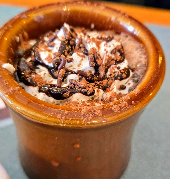 Hot chocolate that doesn't just warm your hands but hugs your soul&mdash;topped with whipped cream and chocolate that's melting like your resolve not to order dessert.