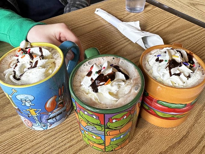 Hot chocolate served in character mugs isn't just a beverage—it's childhood nostalgia with whipped cream on top.