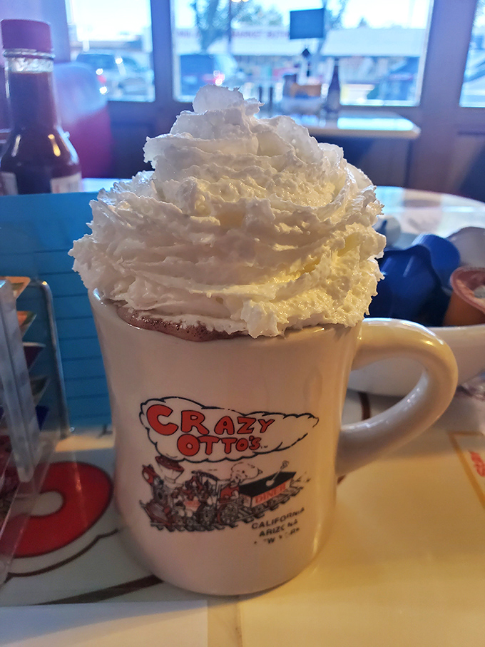 Whipped cream mountain atop hot chocolate so rich it should file its own tax return. The mug alone is worth the drive.