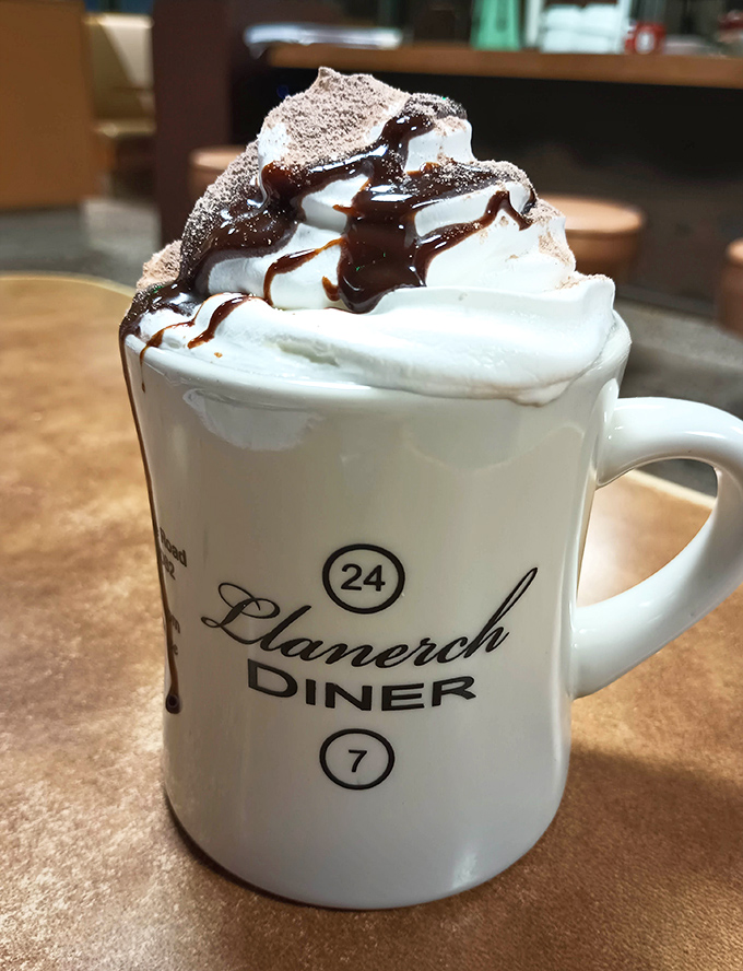 Hot chocolate piled high with whipped cream - because some indulgences are absolutely worth it.