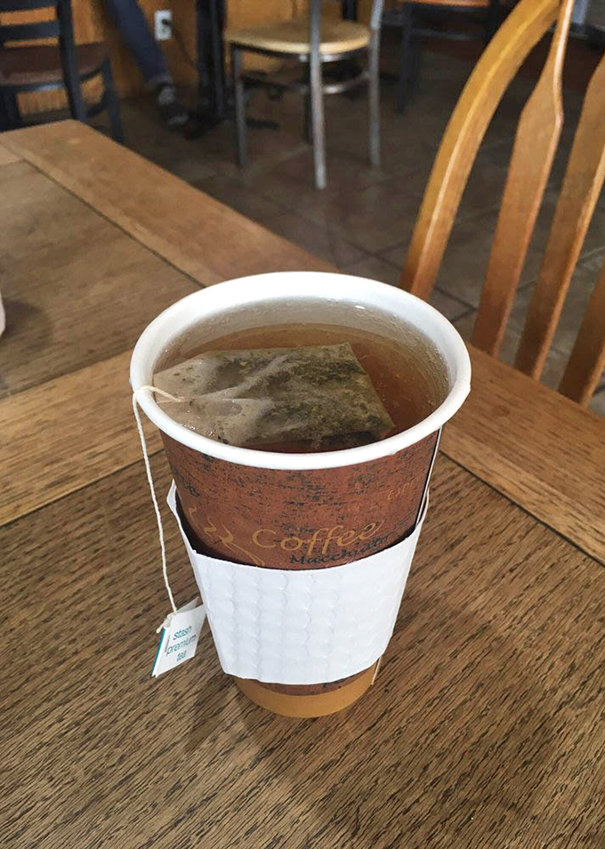 Sometimes the simplest pleasures are best—a steaming cup of tea in a no-nonsense cup, waiting patiently on a wooden table for conversation to begin.