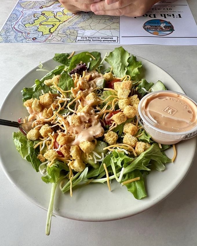 A salad that doesn't apologize for being a salad&mdash;fresh greens, cheese, and those croutons that make you wonder if vegetables were just invented as crouton delivery systems.