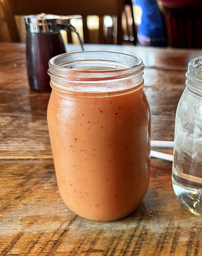 Served in a mason jar because, well, Tennessee. This sunrise-colored smoothie might be the only healthy choice you'll make here&mdash;and worth every sip.