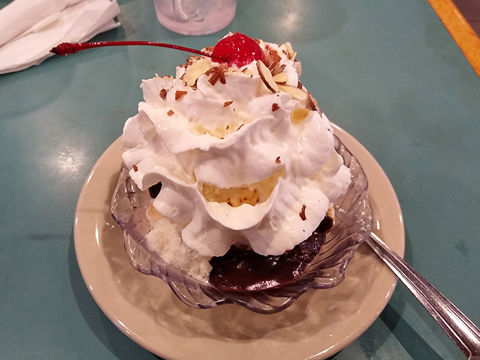 Ice cream sundae architecture at its finest&mdash;hot fudge pooling at the bottom, whipped cream defying gravity, and that cherry on top that makes everything official.