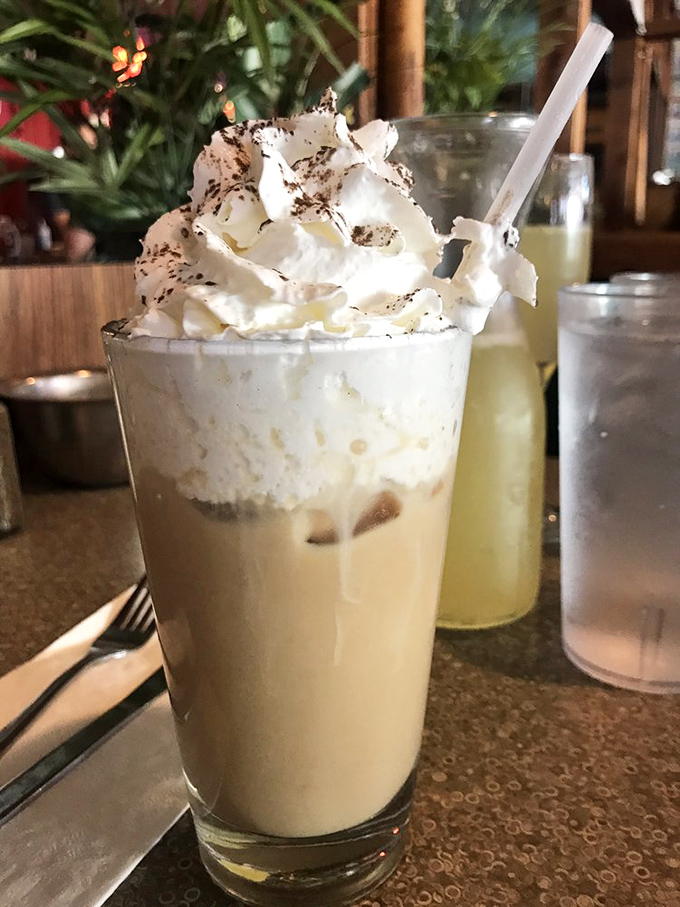 An Irish coffee topped with enough whipped cream to make St. Patrick himself blush&mdash;dessert and caffeine joining forces for the greater good.