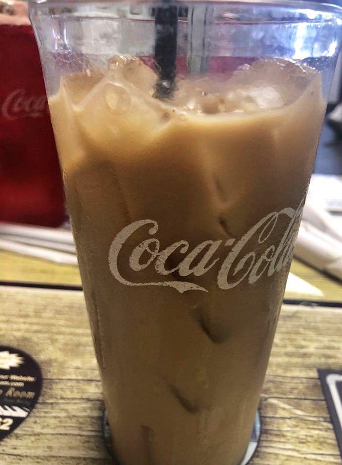 Iced coffee in a classic Coca-Cola glass—because sometimes the best luxury is simplicity served cold with a side of nostalgia.