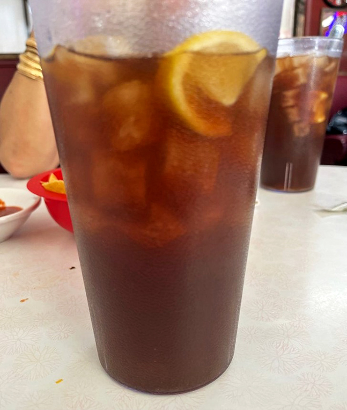 Sweet tea served in a no-nonsense glass with a lemon wedge&mdash;the unofficial hydration station of the Southwest, condensation beading like desert morning dew.