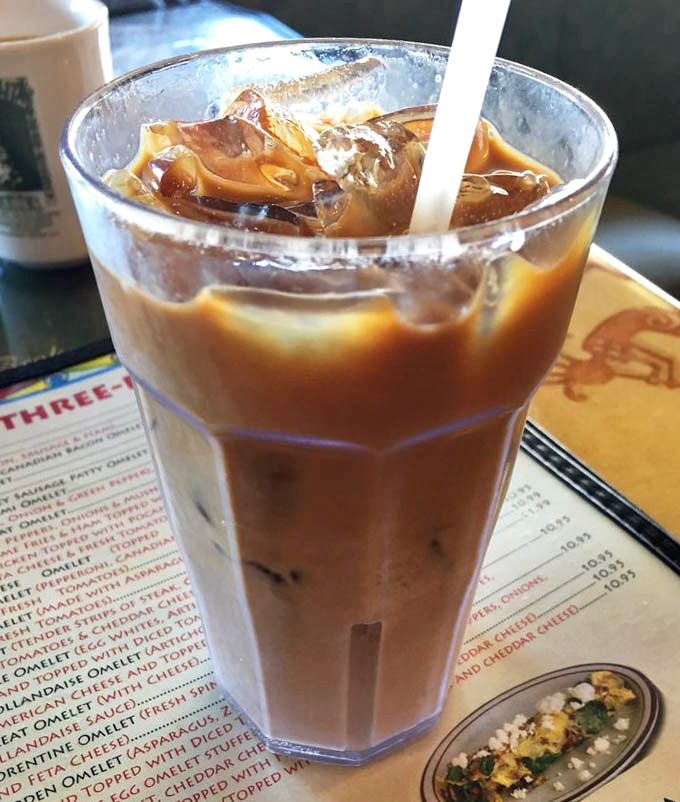 That iced coffee isn't just a beverage&mdash;it's your morning superhero, swooping in to save you from the beach heat with caffeinated superpowers.