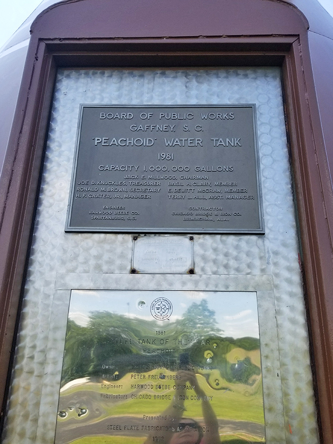 The official plaque reveals the Peachoid's impressive stats: built in 1981, holding one million gallons of water &ndash; that's one juicy piece of fruit!