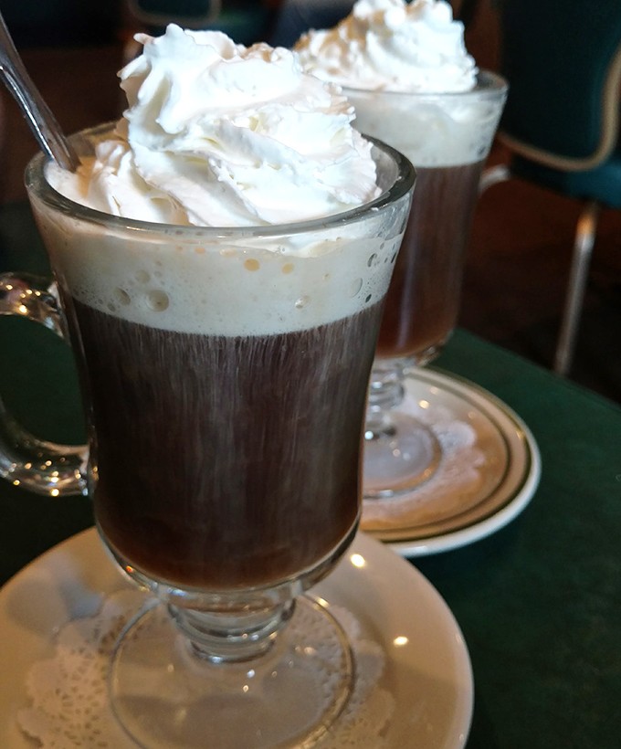 Irish coffee topped with a cloud of whipped cream&mdash;proof that sometimes the best morning motivation comes with a gentle whisper of whiskey.