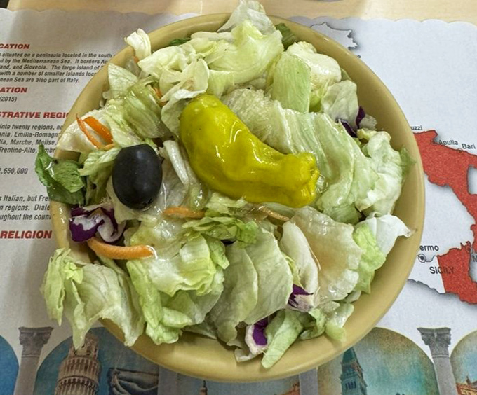 The Italian salad—a simple affair of crisp lettuce, pepperoncini, and olives—offers just enough virtue to justify ordering that second pizza.