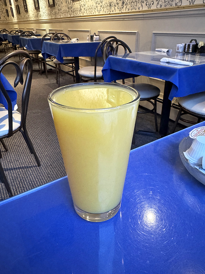 Fresh-squeezed orange juice that glows like liquid sunshine, offering vitamin C with a side of morning optimism.