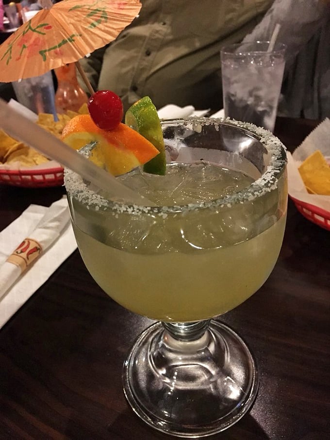 This jumbo margarita comes garnished with fruit and a tiny umbrella, because life's too short for boring drinks.