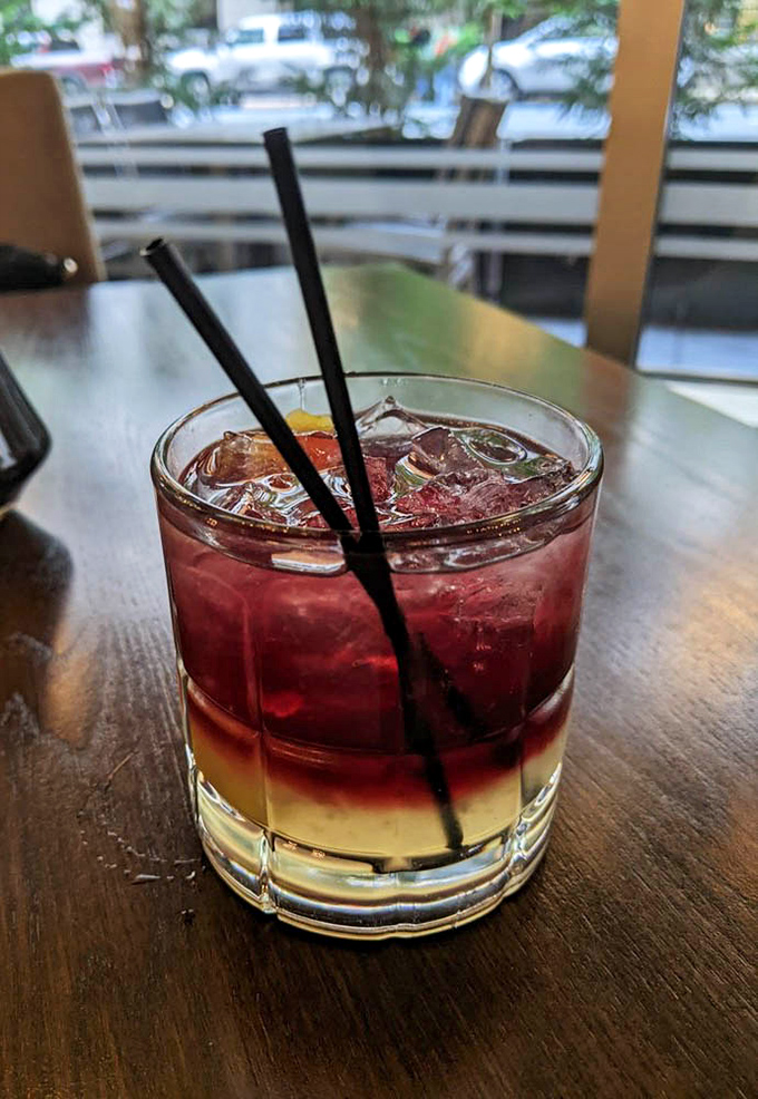 This layered cocktail isn't just a drink, it's a sunset in a glass &ndash; the perfect companion for food-related decision making.