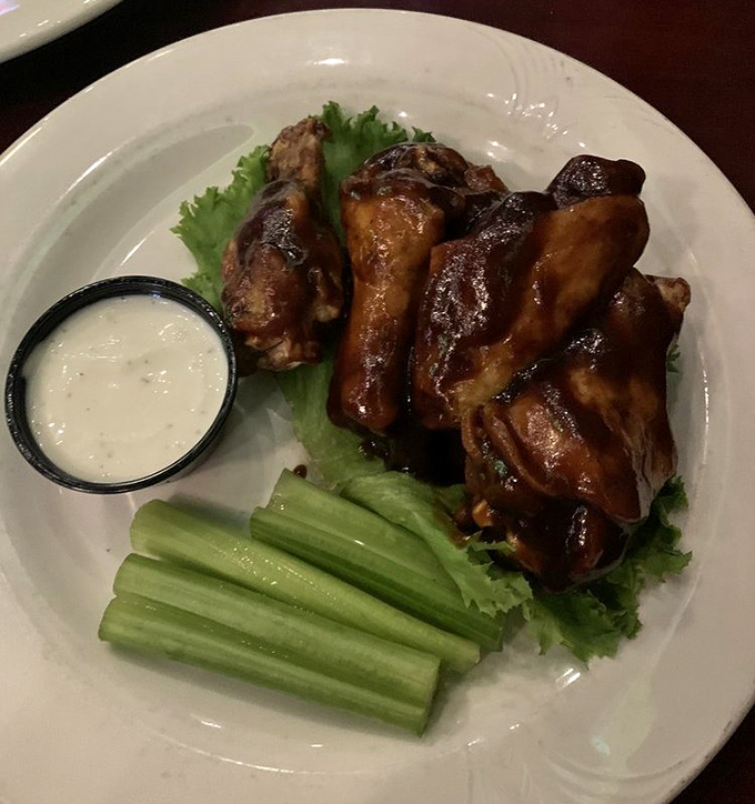 These wings aren't just cooked&mdash;they're transformed by Kentucky bourbon into something that makes vegetarians question their life choices.