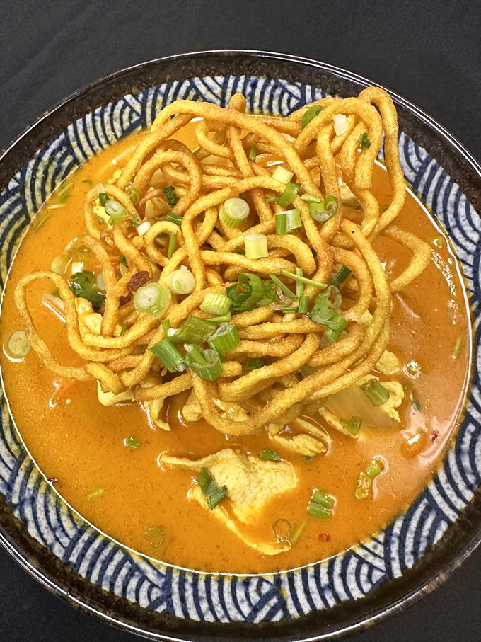 Khao Soi that makes you question everything you thought you knew about noodle soup. Those crispy noodles on top are like the surprise twist in your favorite movie.