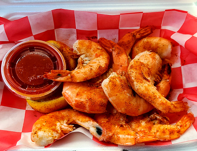 Peel-and-eat shrimp dusted with spices that demand your attention. That little cup of sauce isn't optional&mdash;it's the perfect finishing touch.