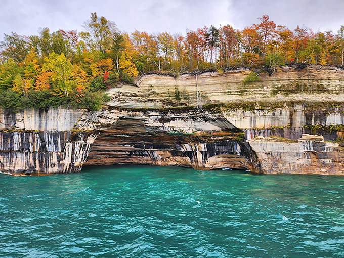 Fall foliage crowns these multicolored sandstone cliffs like nature's tiara&mdash;autumn in Michigan showing off again.