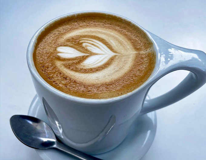 Latte art so pretty you almost don't want to drink it. Almost. The perfect leaf pattern floating on expertly pulled espresso is worth the inevitable caffeine buzz.