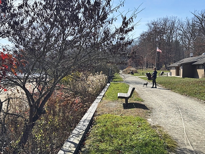 The autumn palette transforms the beach into a golden paradise, though the warning sign serves as nature's version of "look, don't touch" during off-season.