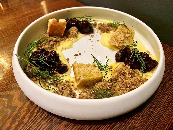 Dessert architecture that belongs in a museum. Those crumbles and berries create neighborhoods of flavor around pools of silky custard.