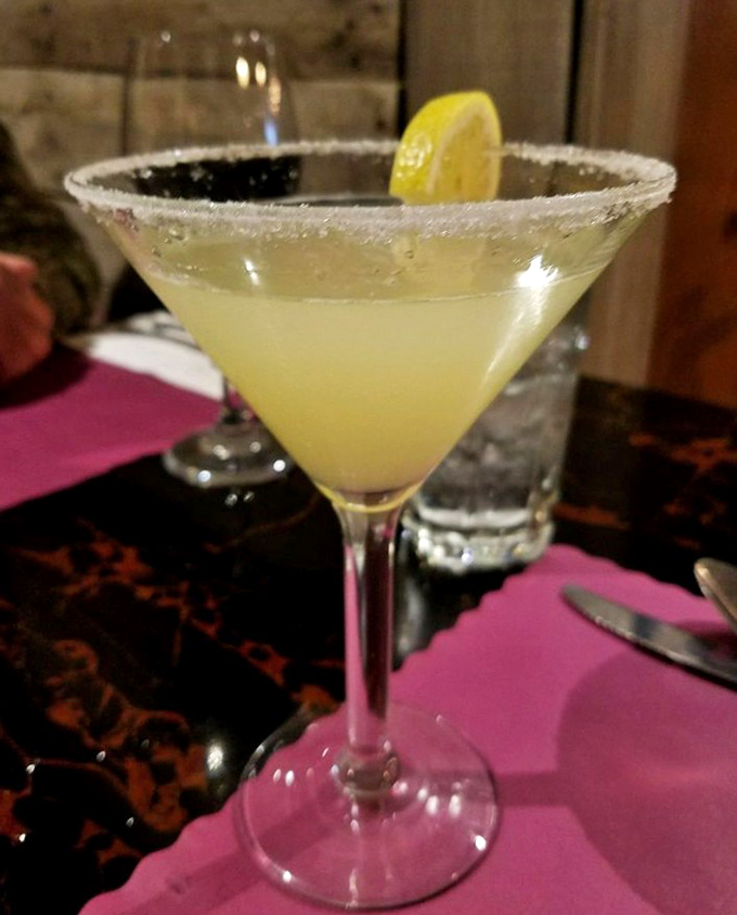 A lemon drop martini with a sugar rim that says, "Yes, you deserve this little moment of citrusy bliss after that hike through the Grand Canyon."