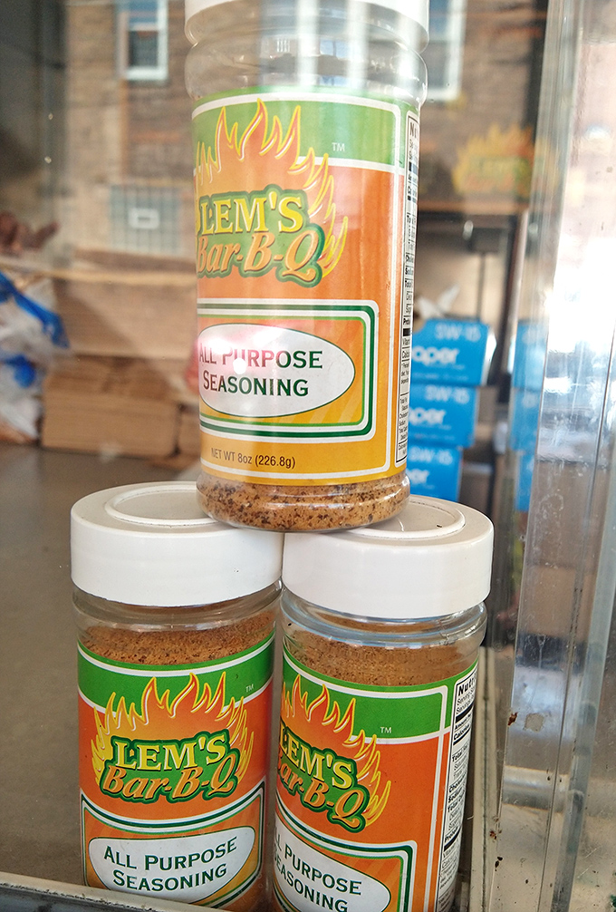 Bottles of Lem's seasoning stand ready to transform home cooking into something that might&mdash;just might&mdash;approach the magic happening behind that counter.
