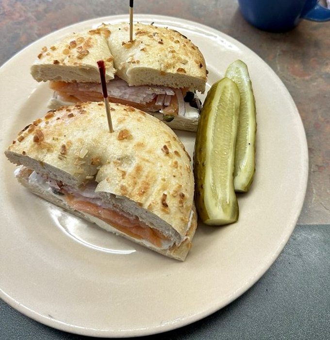 The lox bagel sandwich&mdash;proof that sometimes the simplest combinations are culinary genius. Those pickles standing at attention know they're in the presence of greatness.