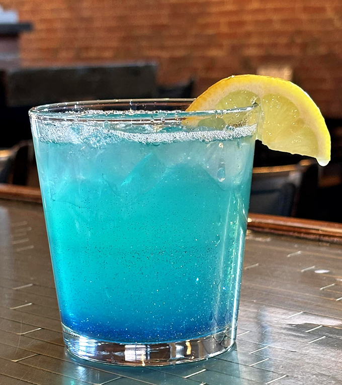 The Lunar Twilight cocktail glows an otherworldly blue, promising refreshment with a citrusy twist&mdash;like drinking a summer sky at sunset.